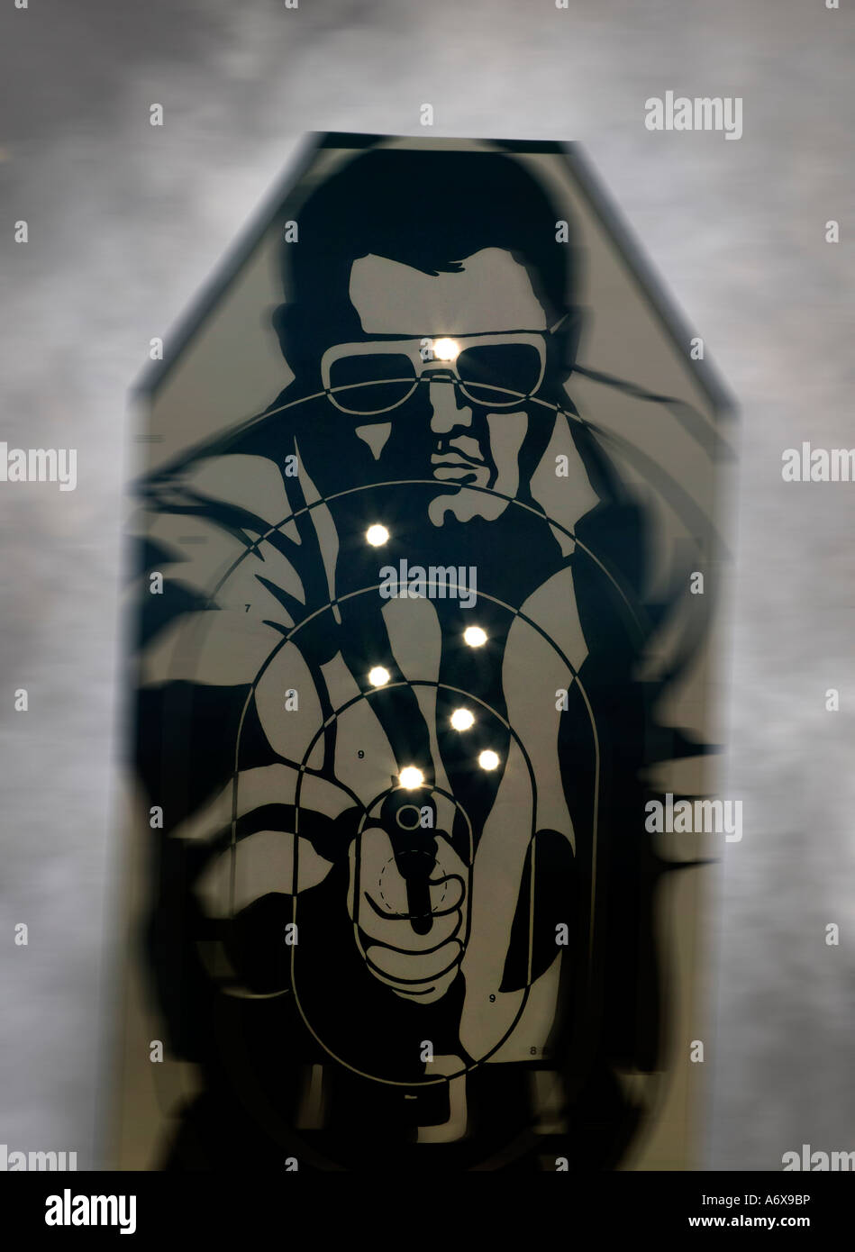 A shooting practice target riddled with bullet holes Stock Photo - Alamy