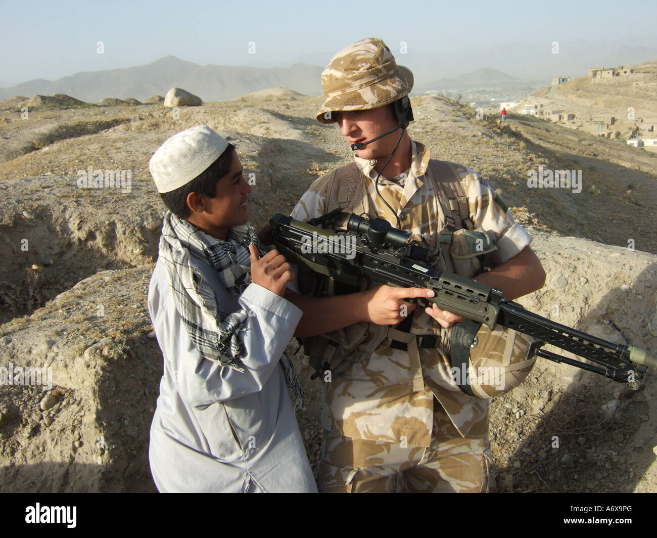 A British Army foot patrol with local Afghan children Stock Photo - Alamy