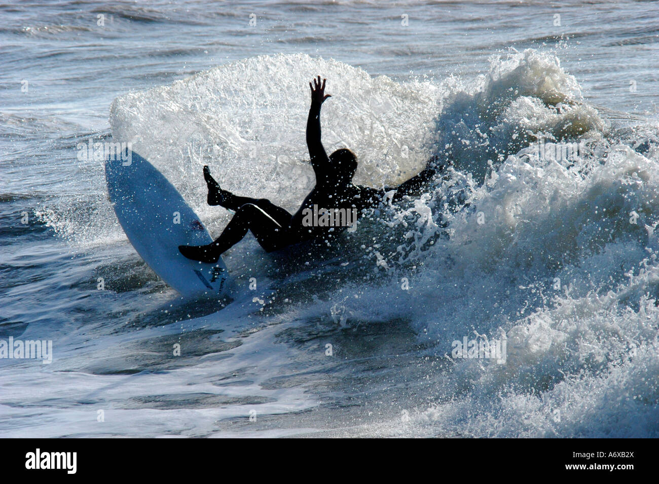 surfer falling of a wave south coast england Stock Photo - Alamy