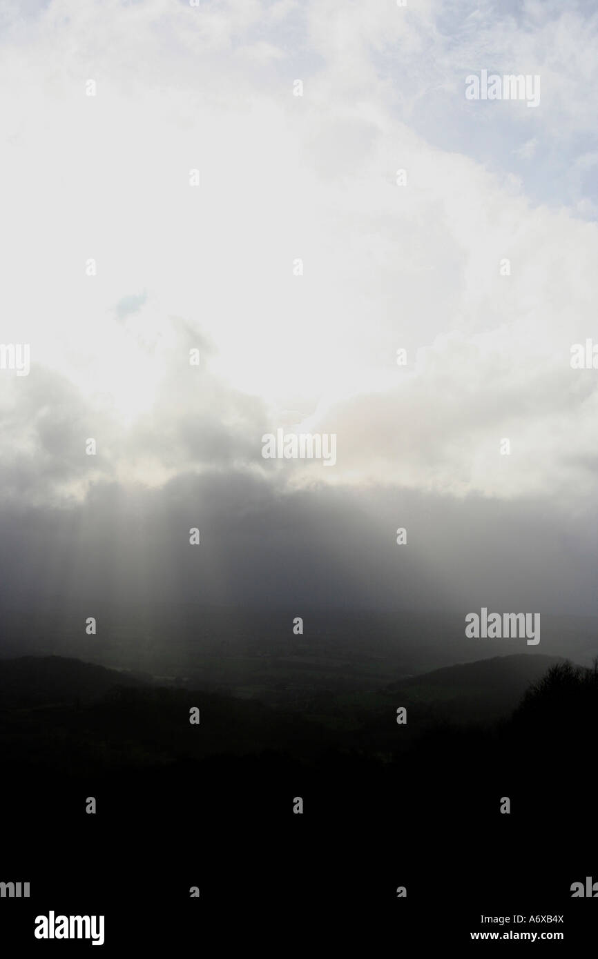 sun streaming through clouds with view to the black mountains from the ...