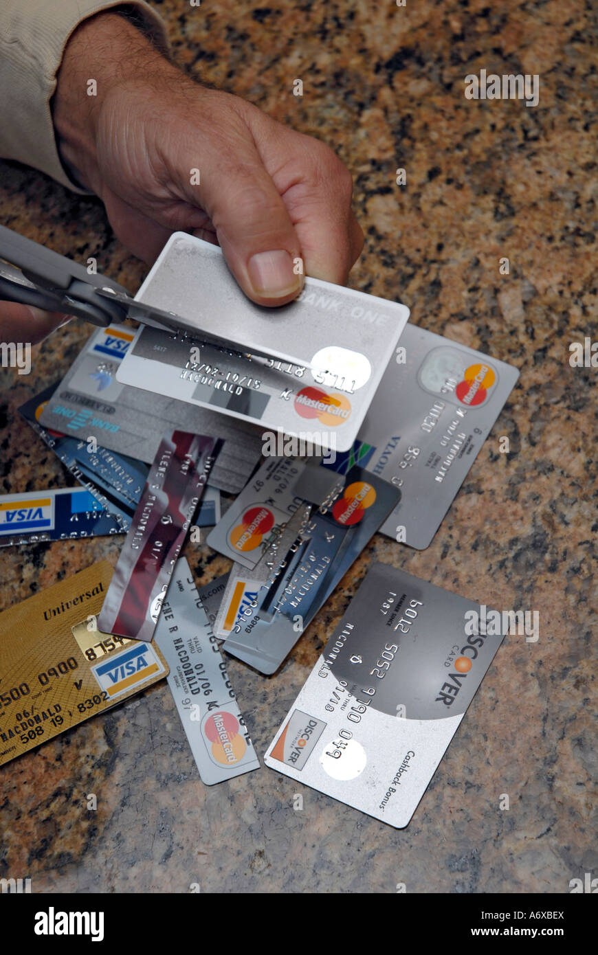 The cutting up of credit cards Stock Photo - Alamy