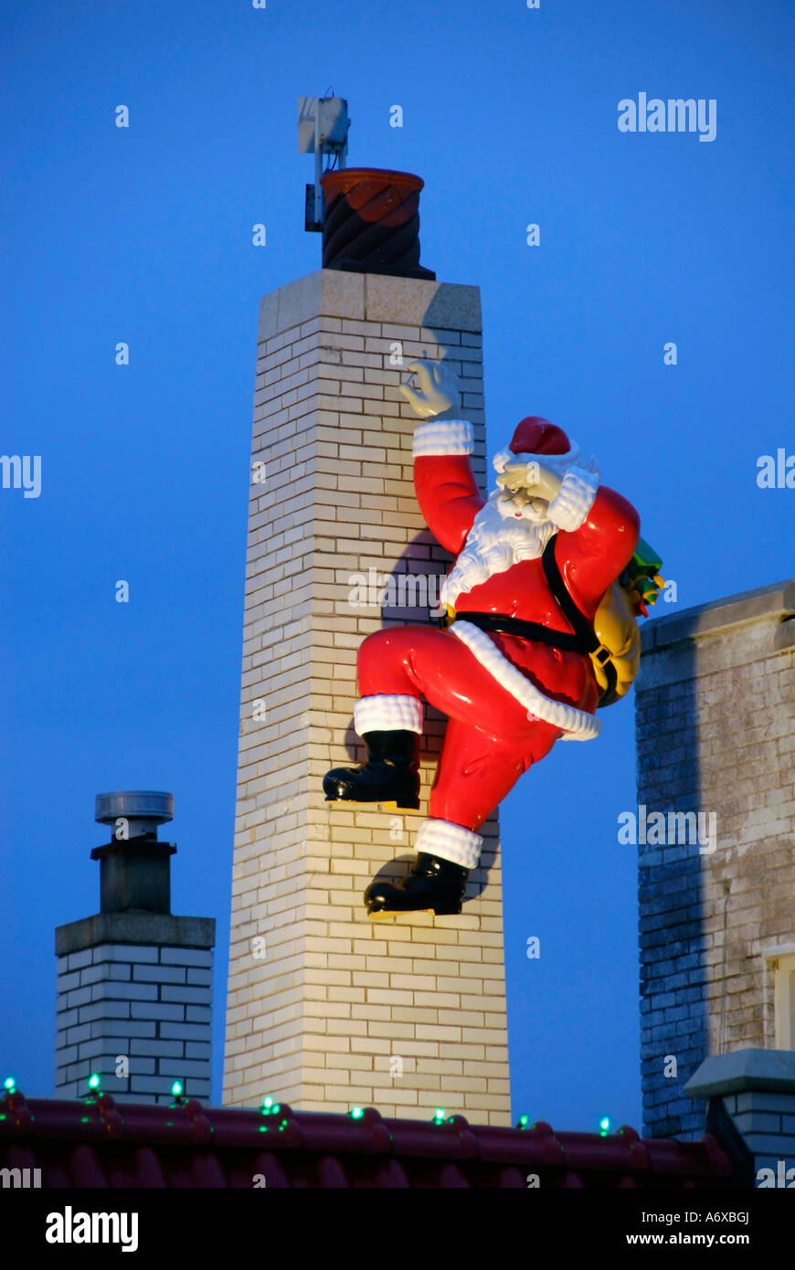 Santa claus climbing chimney hi-res stock photography and images - Alamy