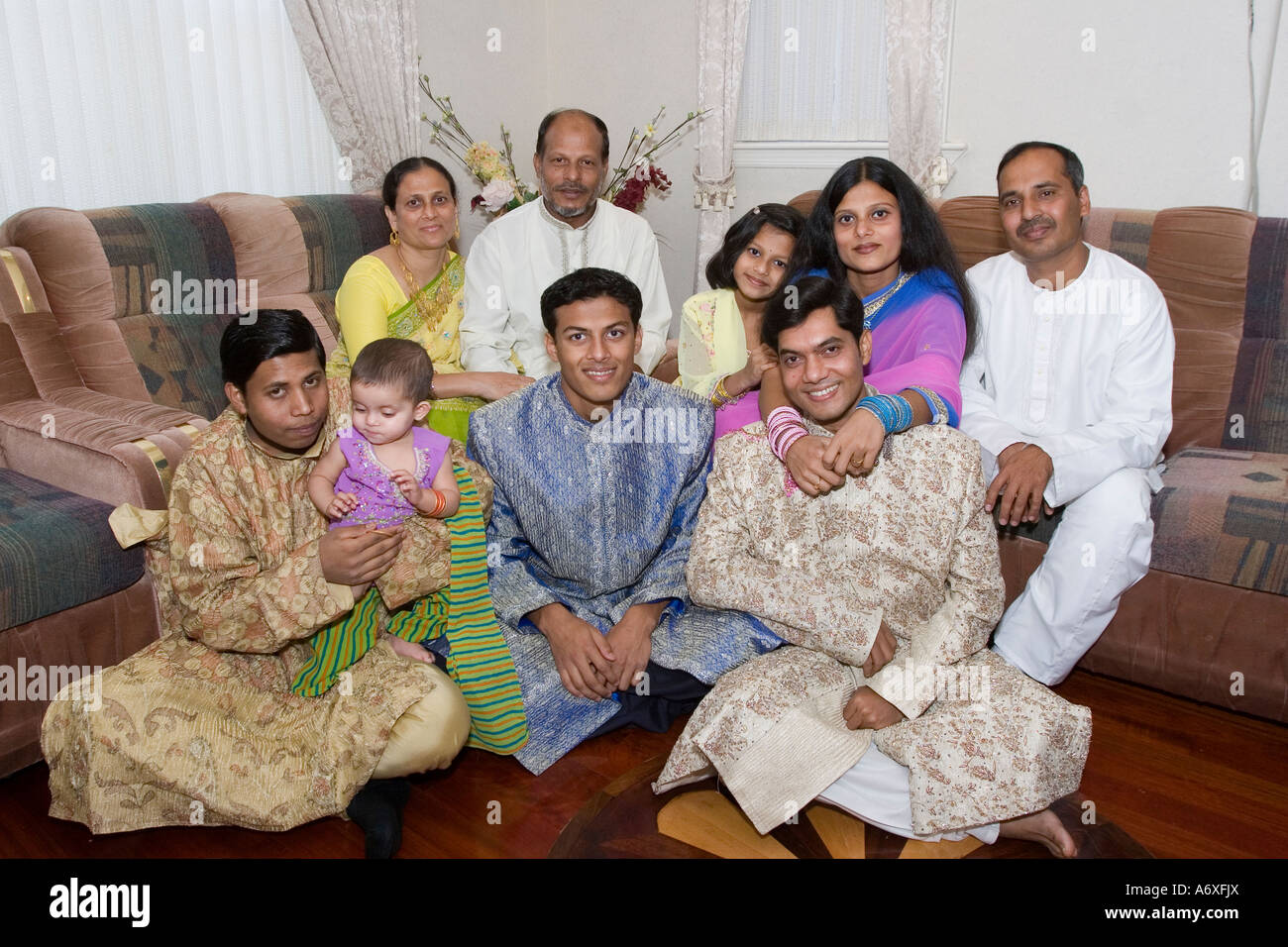 Bangladeshi American family at home for the Muslim holiday of Eid Stock ...