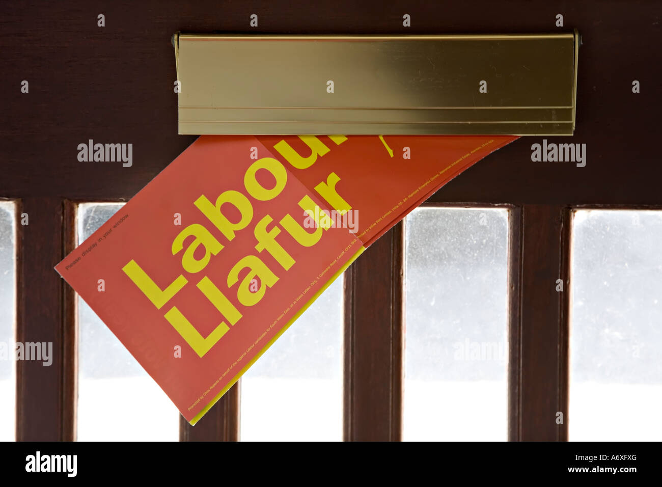 Labour political party leaflet being pushed through letterbox before ...