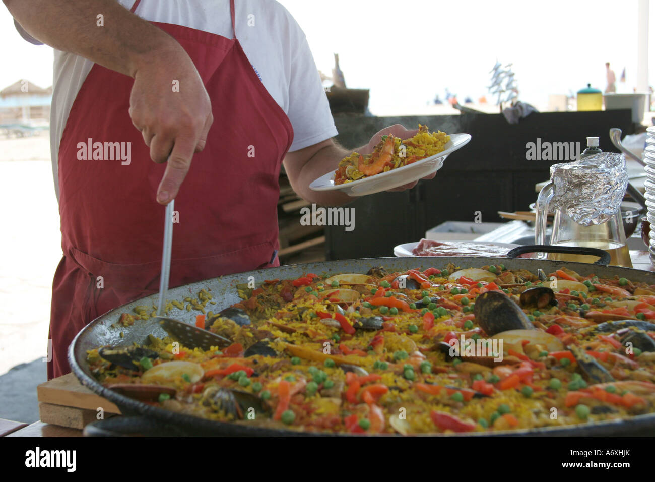 chef making paella on Spanish beach Stock Photo - Alamy