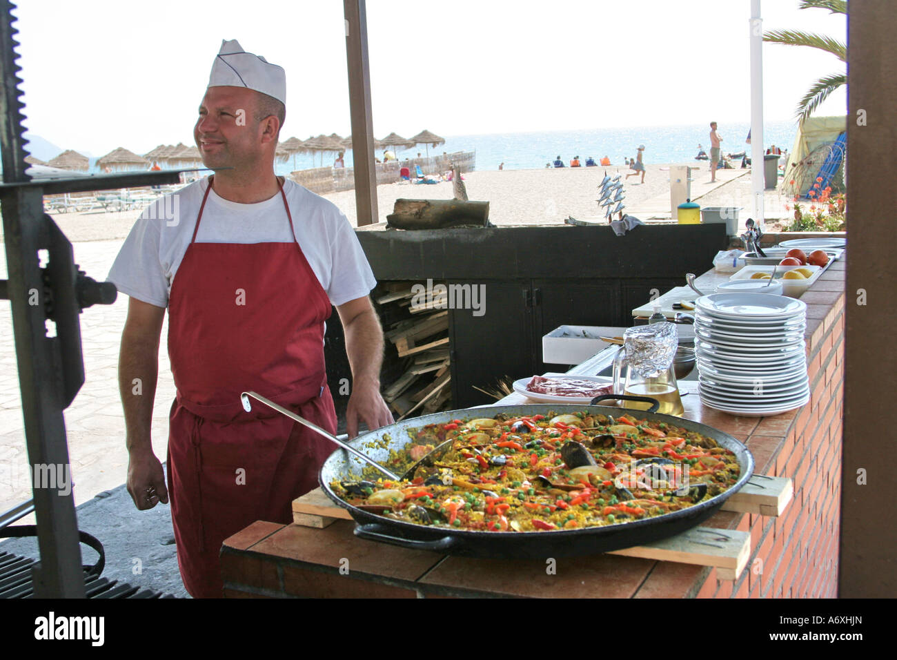 chef making paella on Spanish beach Stock Photo - Alamy