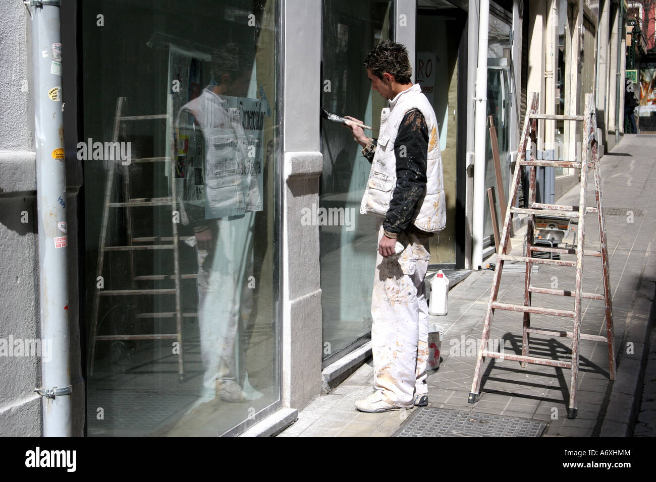 Painting outside of shop Stock Photo - Alamy