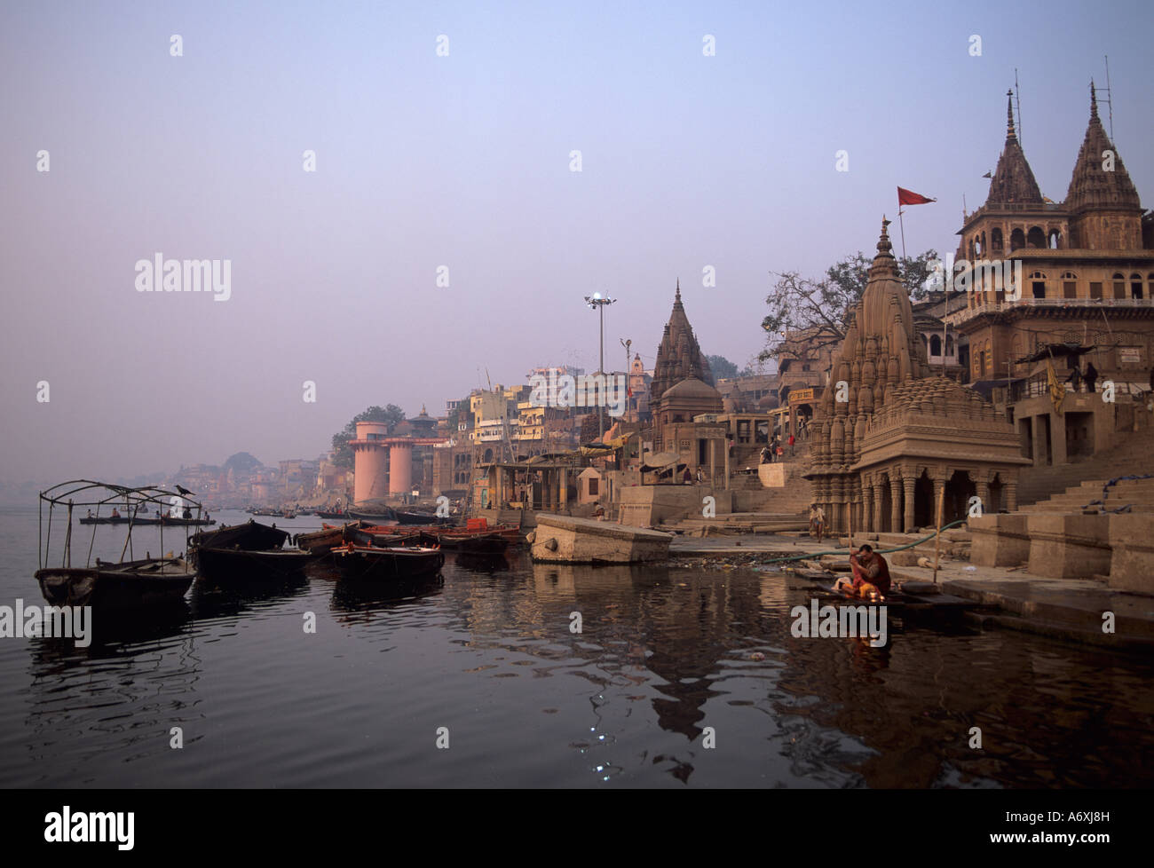 Holy man on Scindia Ghat on the bank of the River Ganges in Varanasi ...