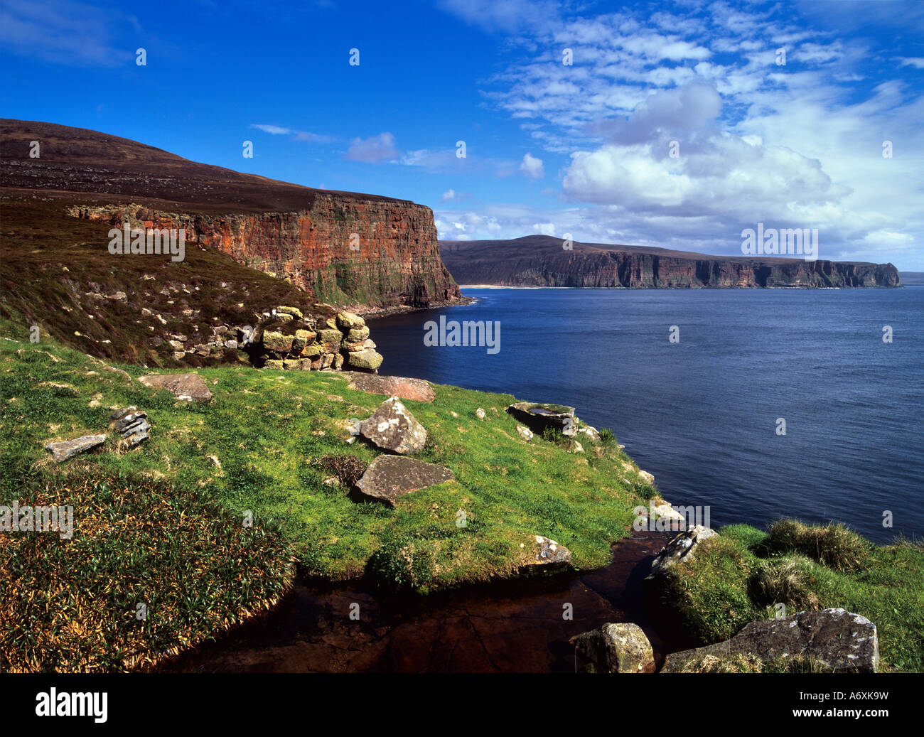 The red sandstone cliffs of North West Hoy with Rackwick Bay in the ...