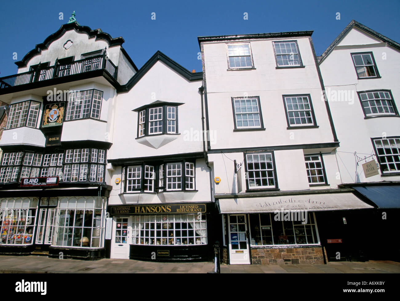 Shops in Tudor buildings Cathedral Green Exeter Devon England United ...