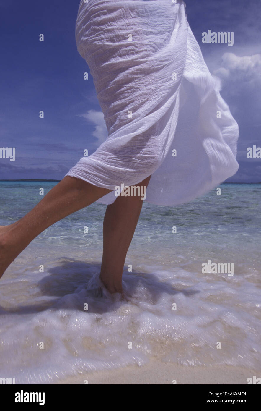 Caribbean, Bahamas, Nassau Woman walking and beach view, New Providence ...