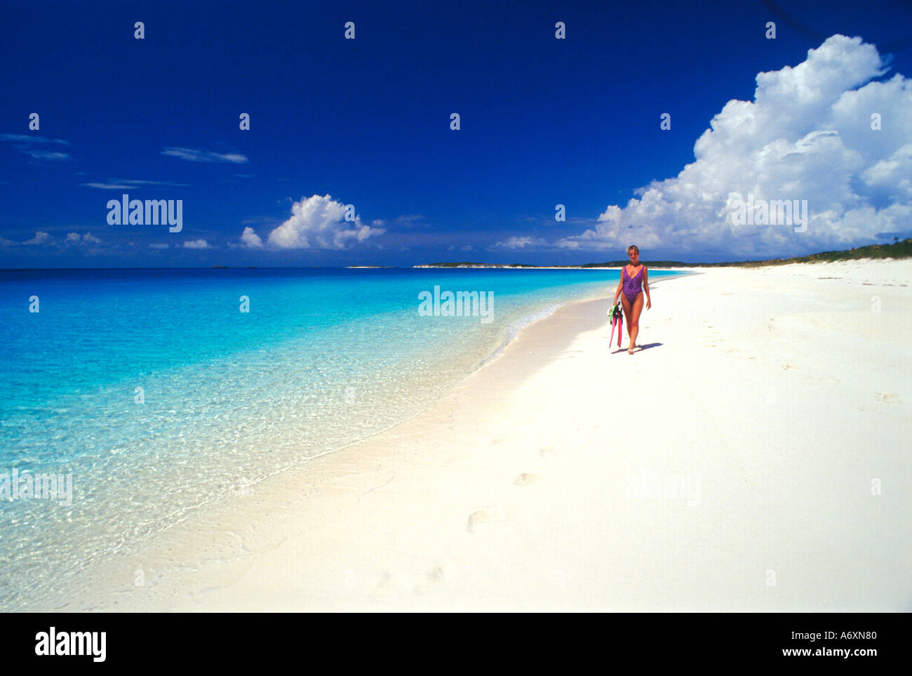 Woman on pristine beach, Conception Island, Long Island, Bahamas. (MR ...