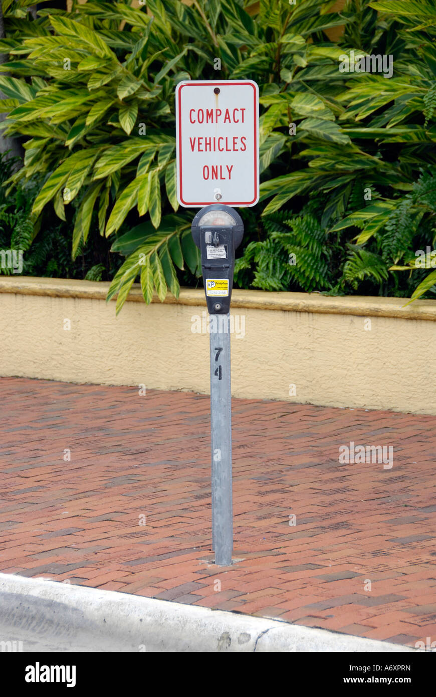 Compact car only parking sign and meter Stock Photo - Alamy