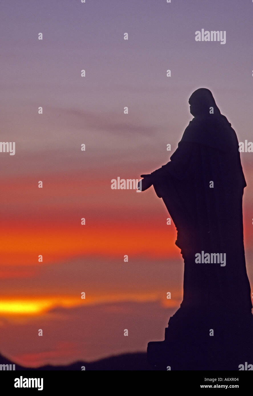 Caribbean, Curacao. Silhouetted statue at sunset Stock Photo - Alamy