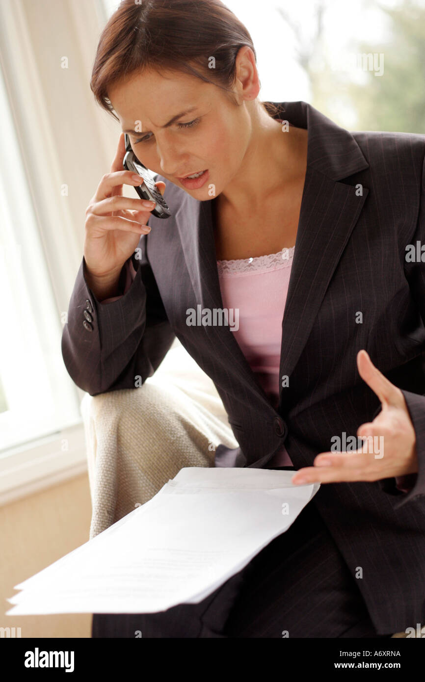 Woman complaining on the phone Stock Photo - Alamy