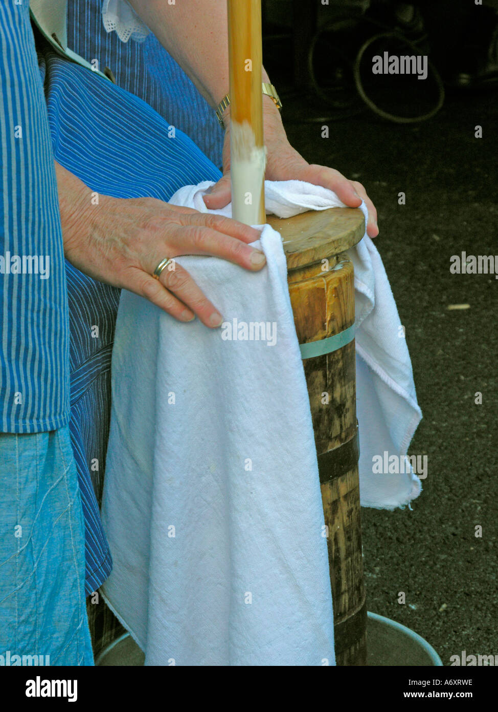 old tradition timber butter tub hands of a woman by making butter Stock ...