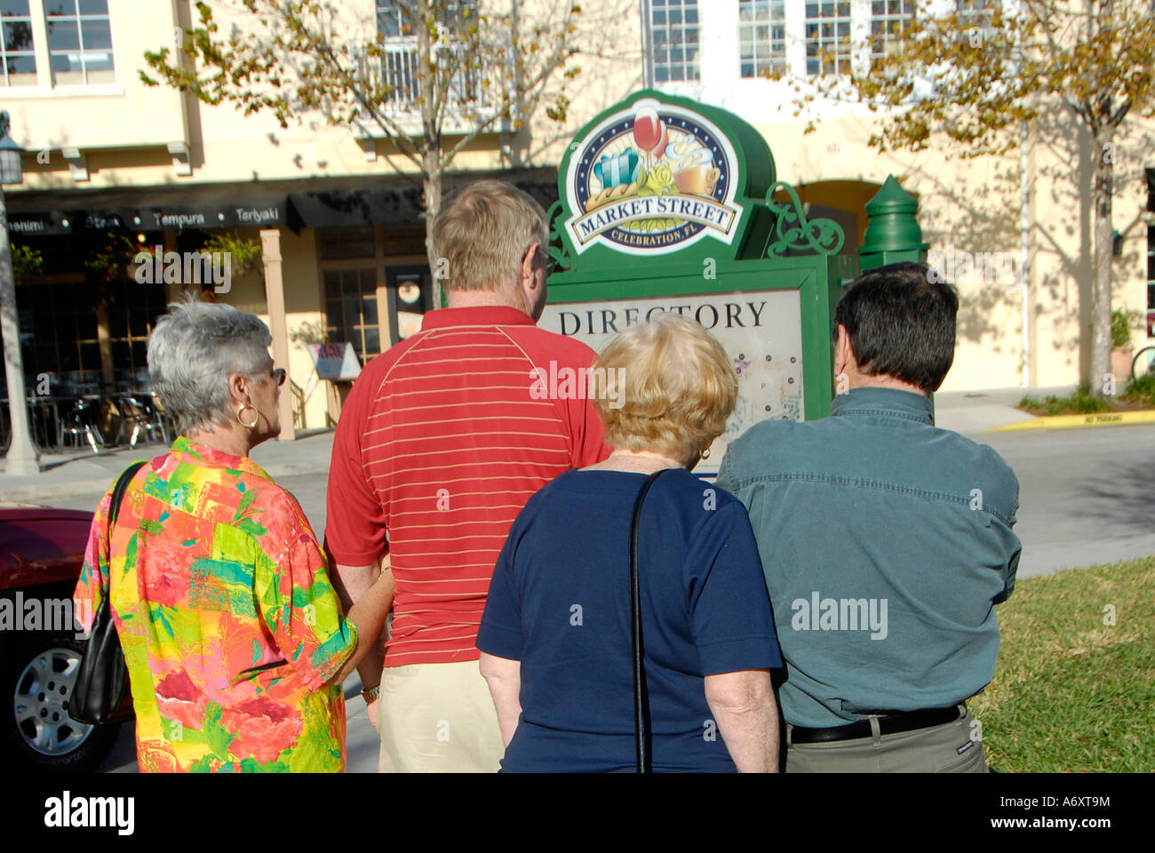 Visitors Study Market Street Sign in Celebration Florida near Kissimmee ...