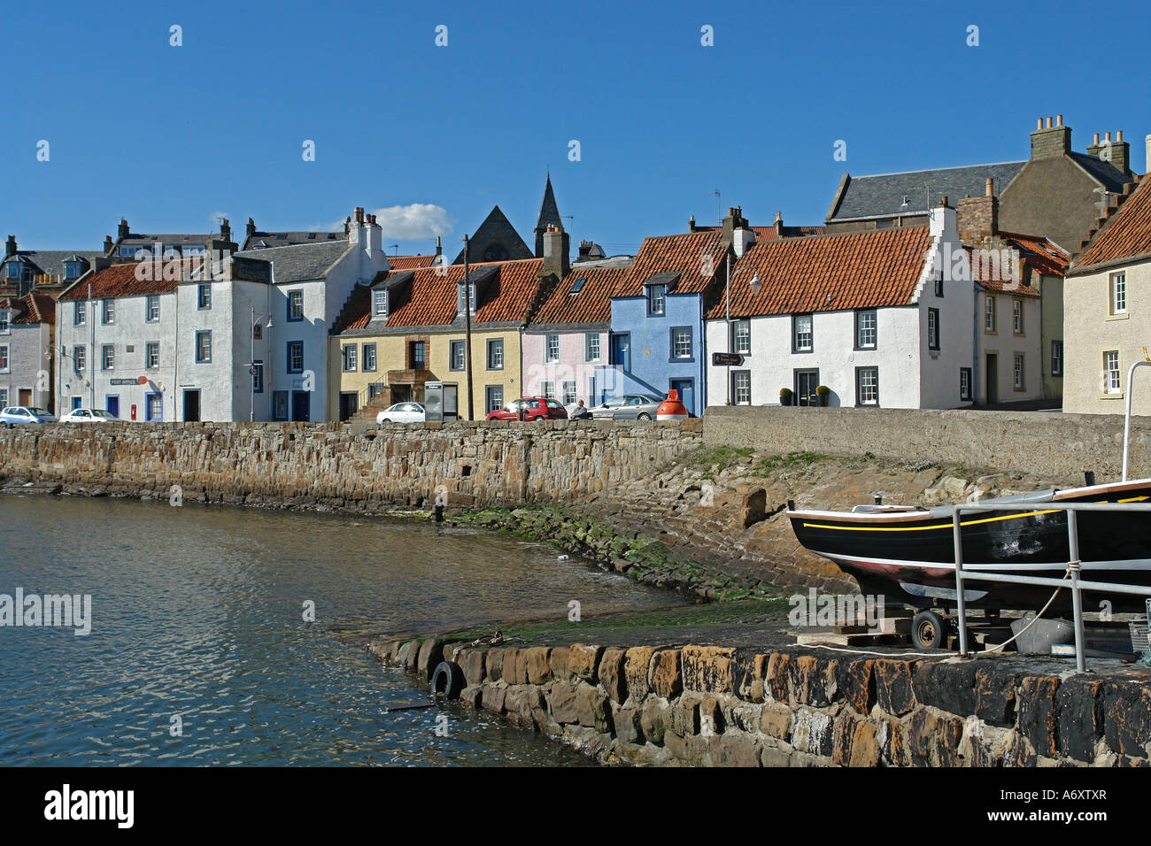 St. Monans harbour in Fife Scotland with traditional houses in the ...