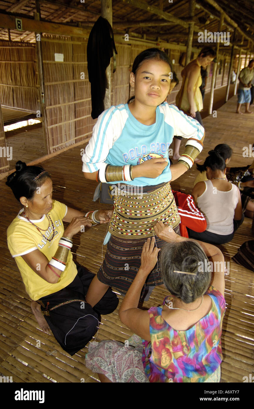 Rungus women dressing girls for ceremony sabah malaysia Stock Photo - Alamy