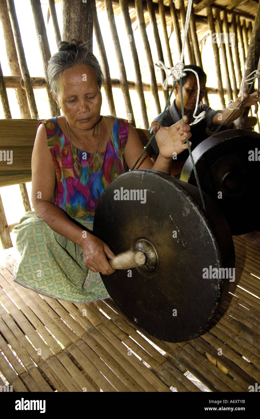 Rungus woman playing traditional gong Stock Photo - Alamy