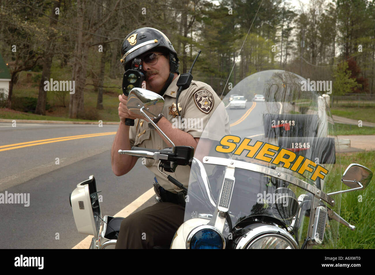 County sheriff s deputy uses laser device to check speed of traffic ...
