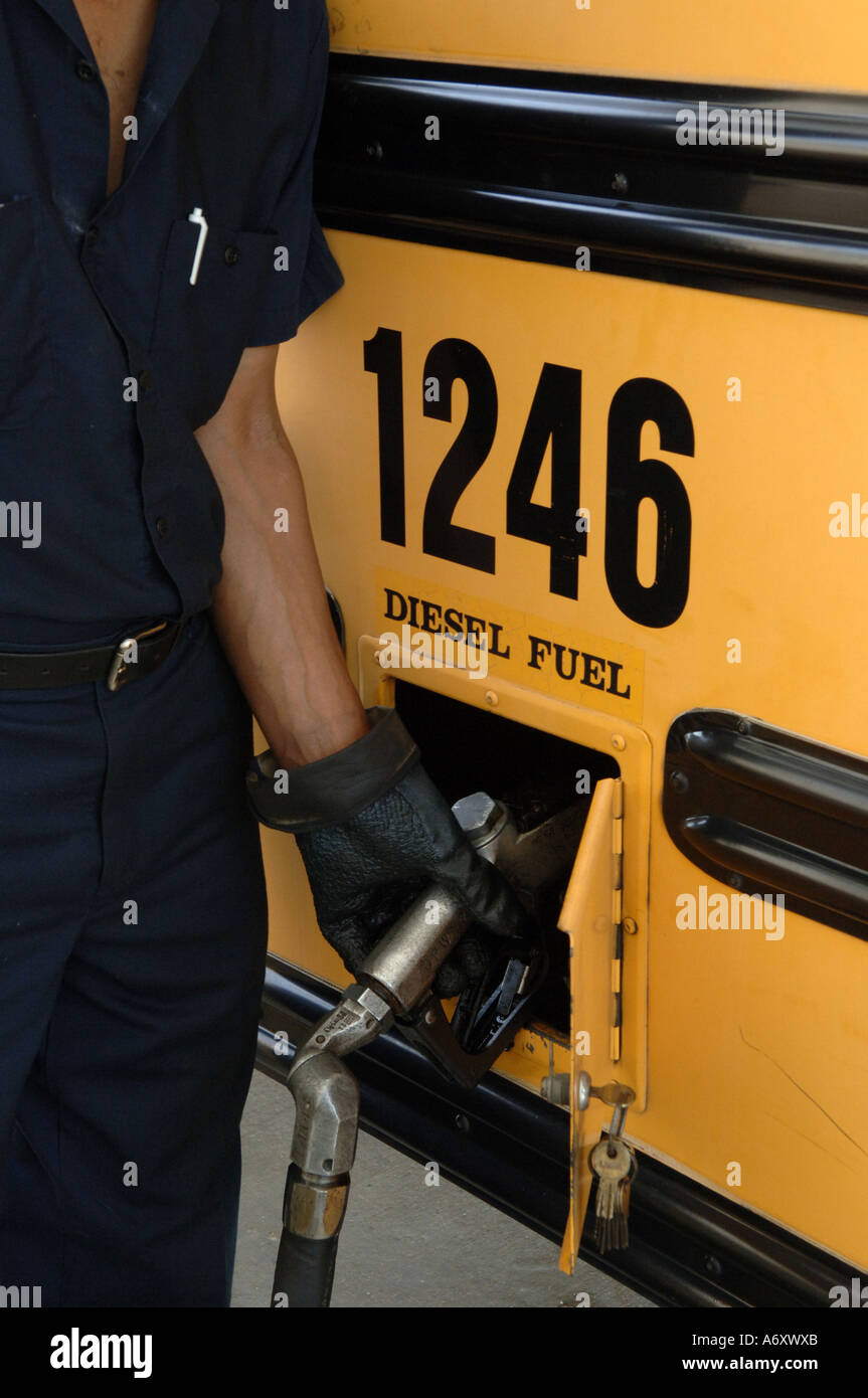 School system employee fuels a diesel powered school bus Decatur GA ...