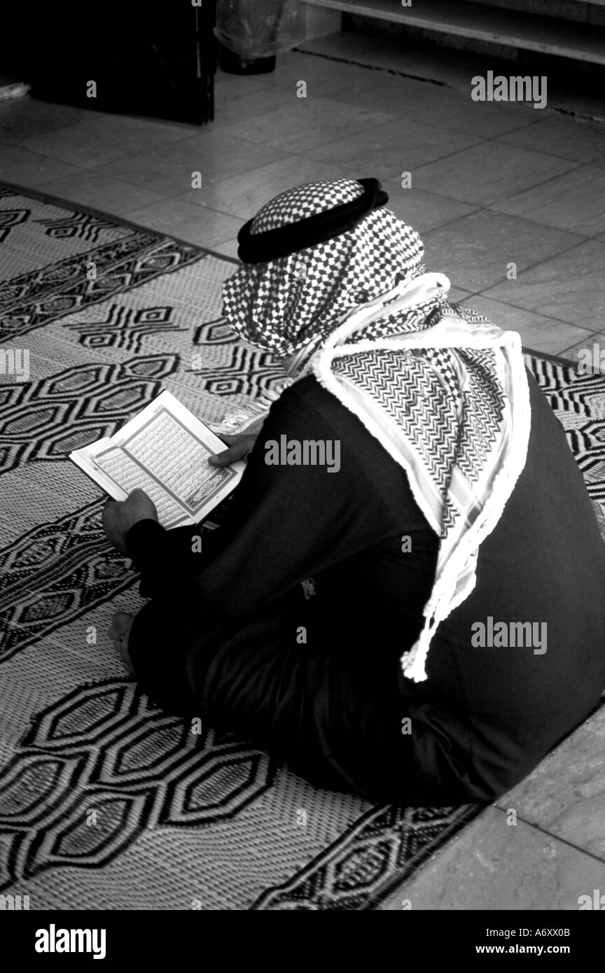 Arabic man reading Stock Photo - Alamy