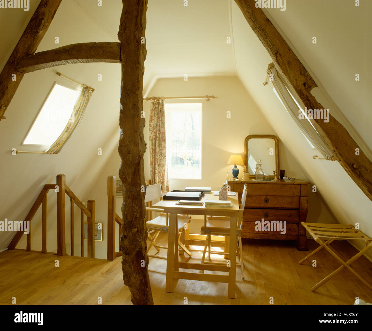 Study in attic conversion with wooden floor and apex ceiling Stock ...