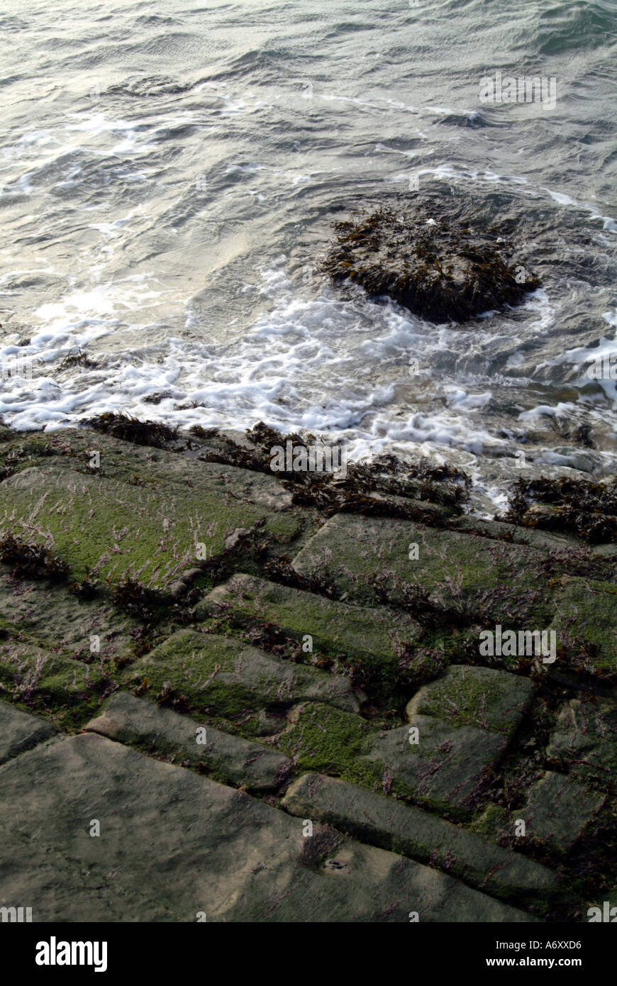 Shoreline with waves arriving on a breaker Stock Photo - Alamy