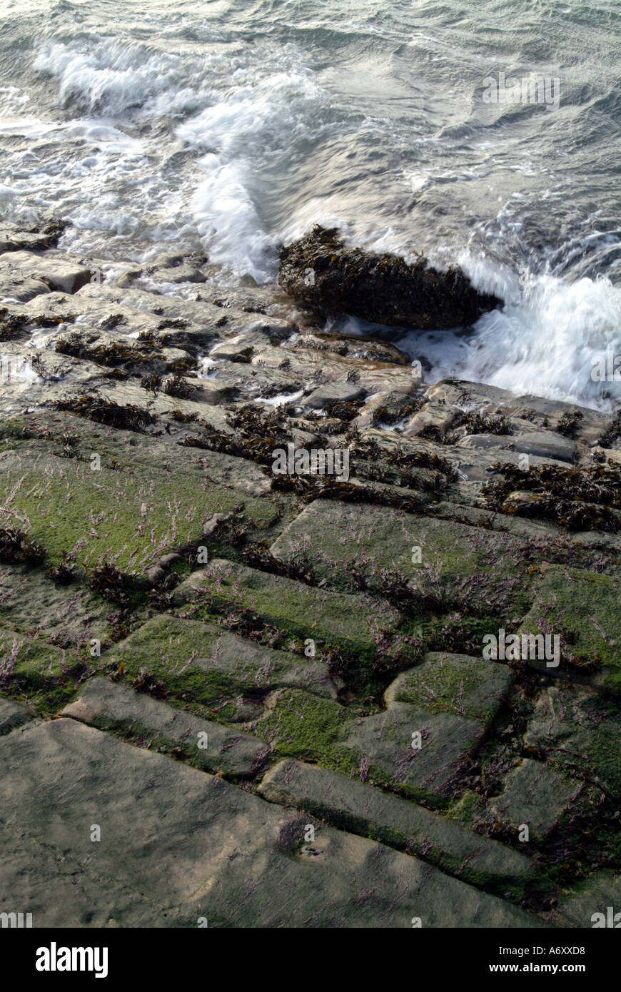 Shoreline with waves arriving on a breaker Stock Photo - Alamy