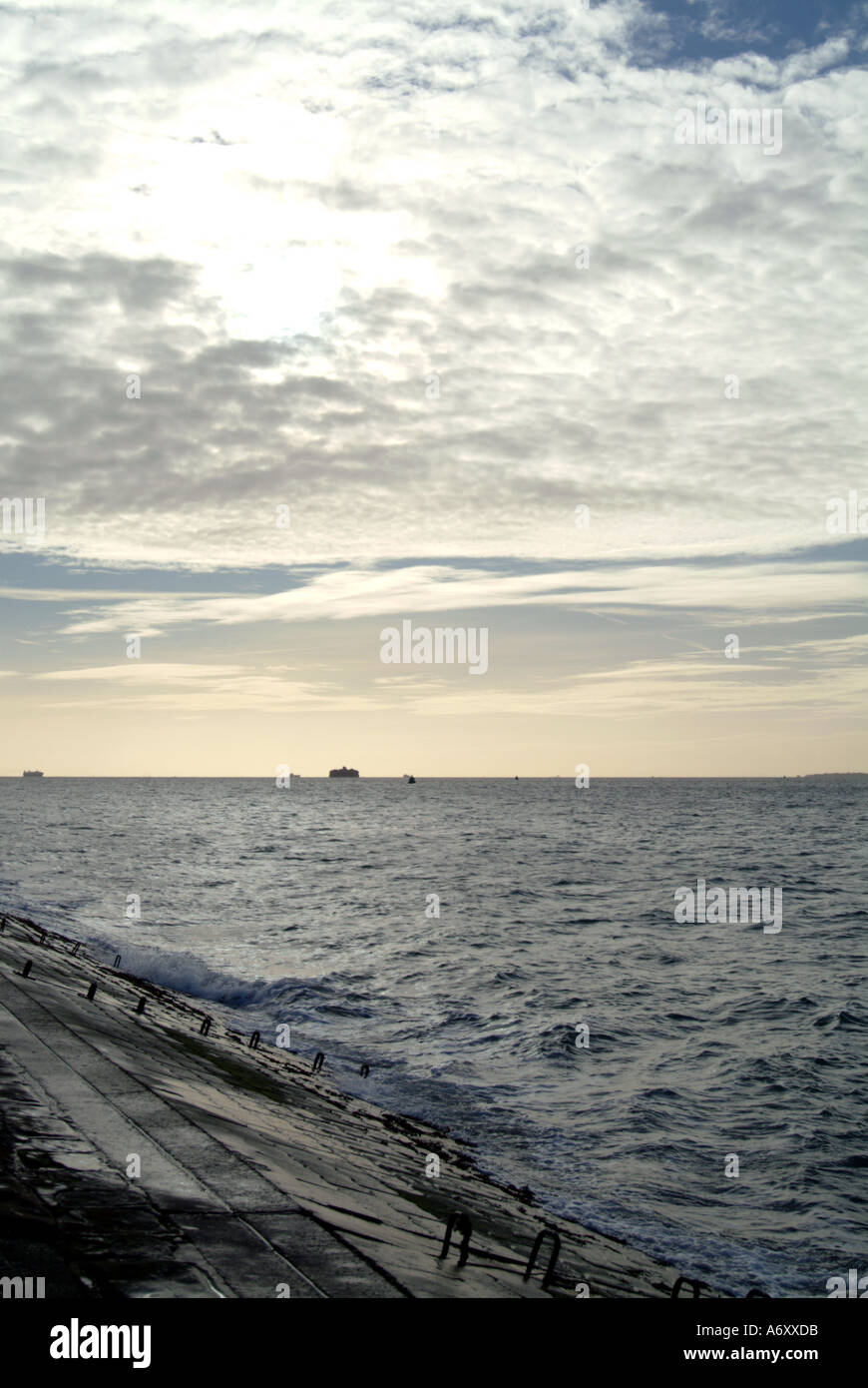 Shoreline with waves arriving on a breaker Stock Photo - Alamy
