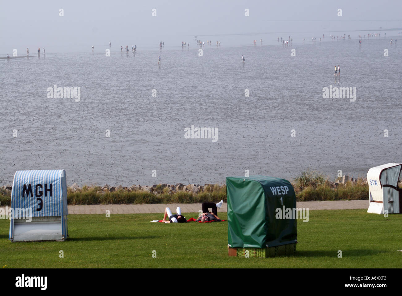 People walking on the bottom of the North Sea while low tide, in Buesum ...