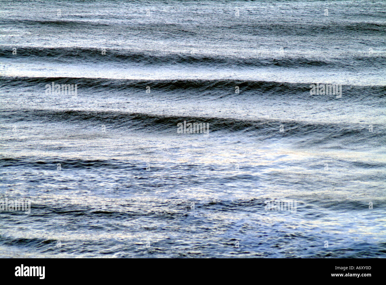 Waves arriving on a beach Stock Photo - Alamy