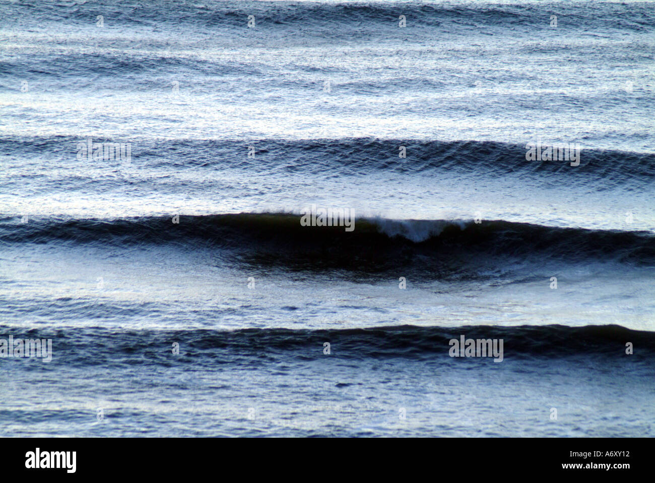 Waves arriving on a beach Stock Photo - Alamy