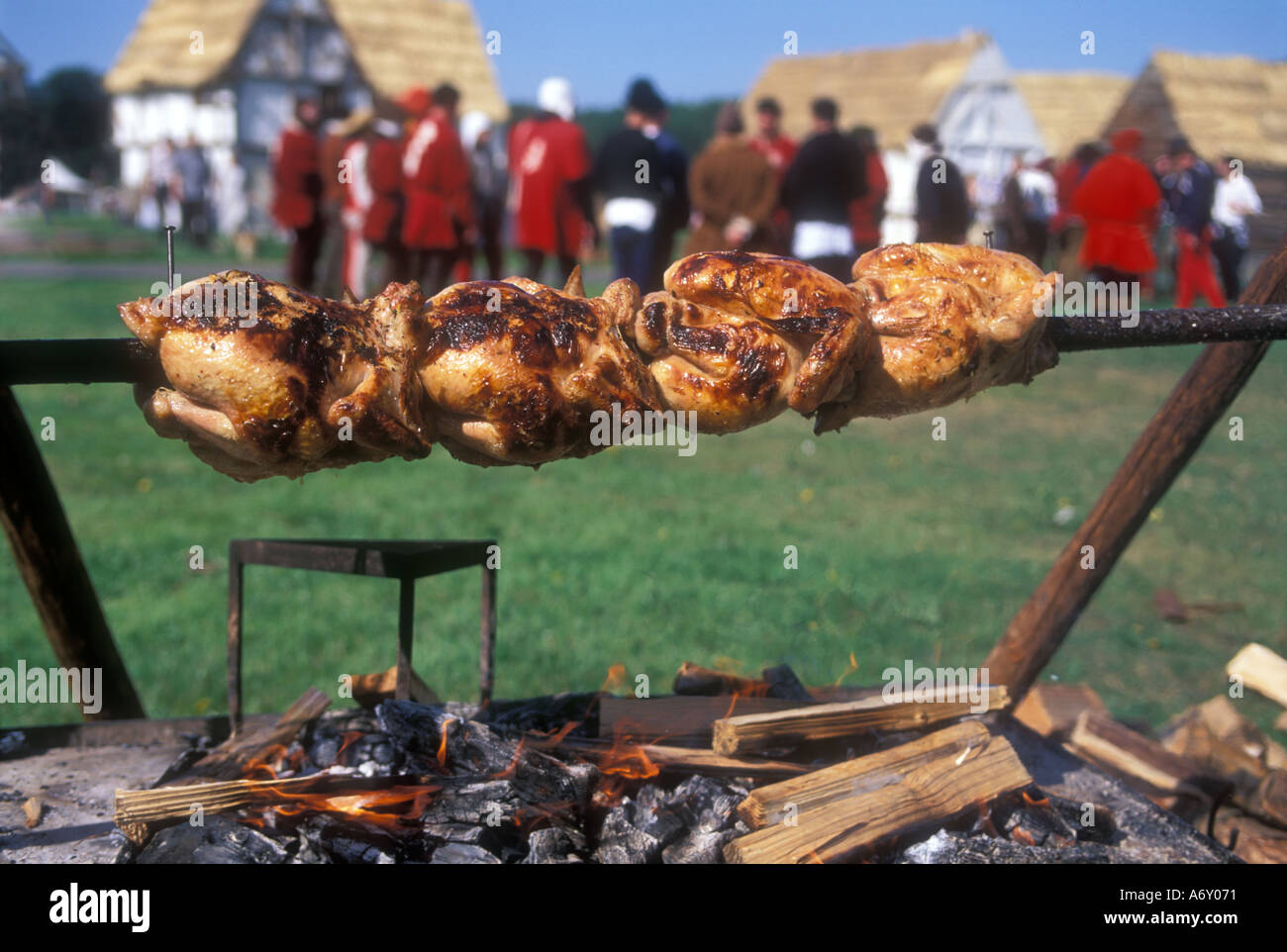 Chickens roasting on a spit at the English Heritage Festival of History ...