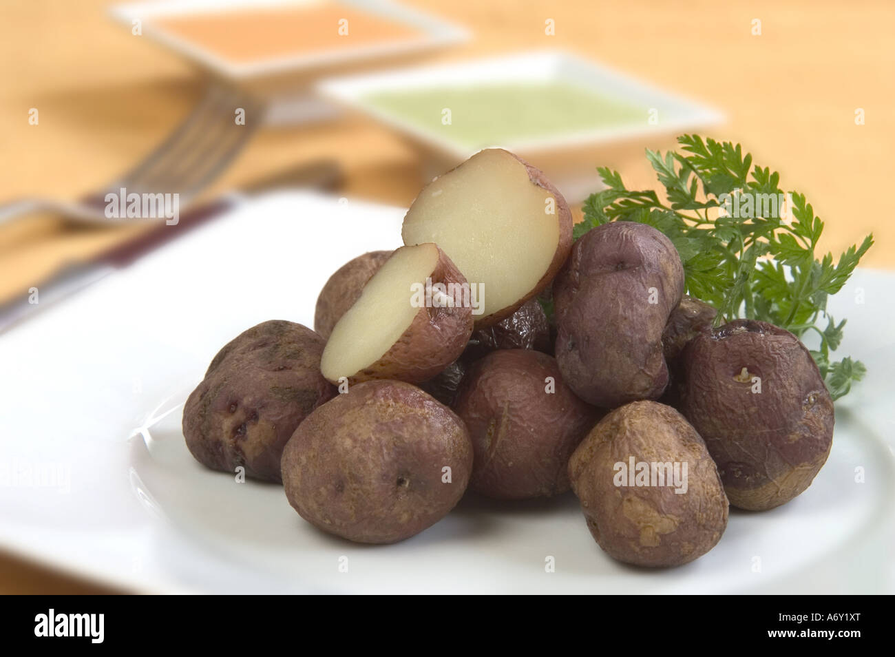 Black potatoes from the Canaries with red mojo and green mojo sauces ...