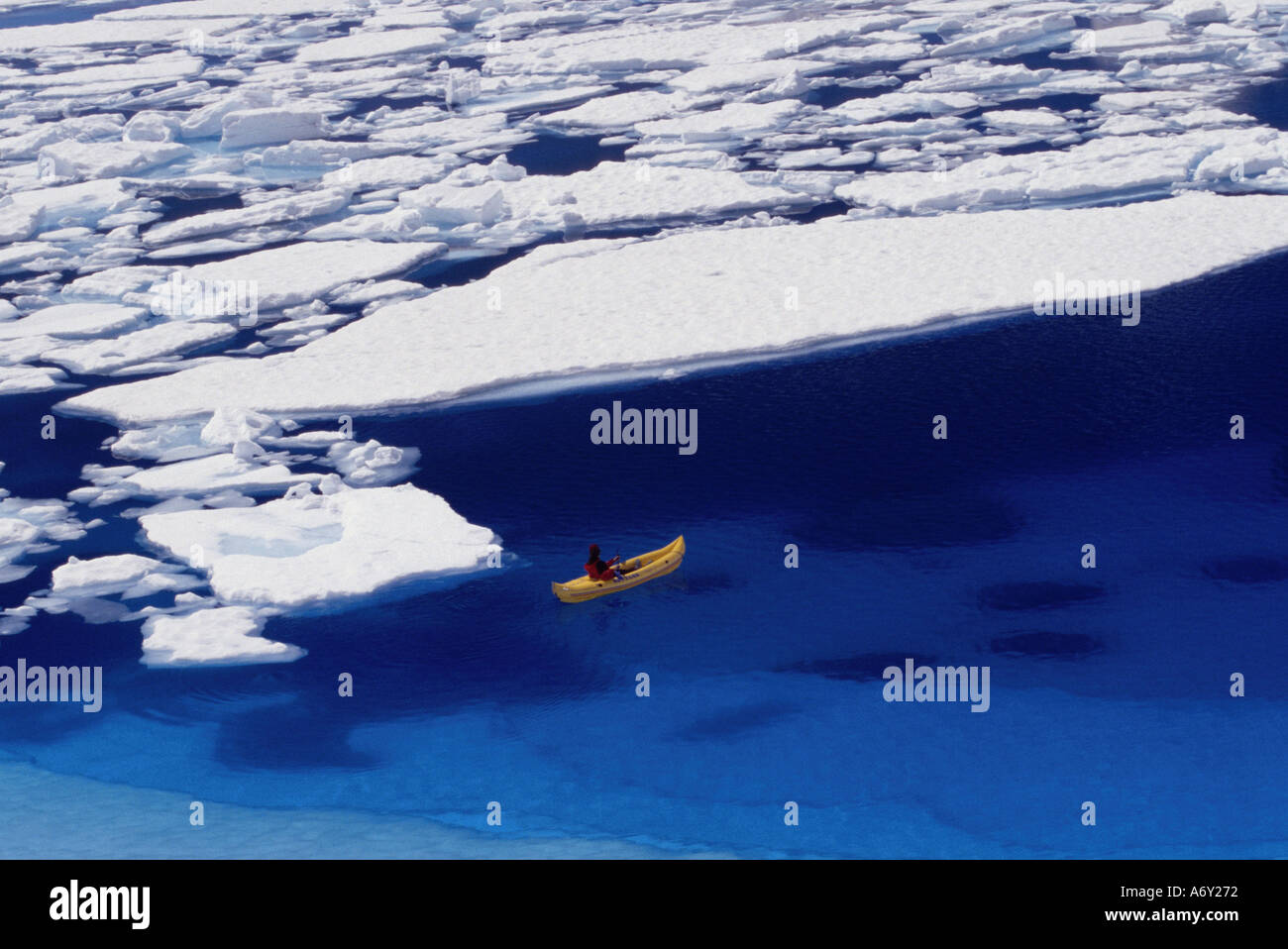 Woman Relaxing in Kayak Blue Melt Pond Juneau Icefield AK Stock Photo ...