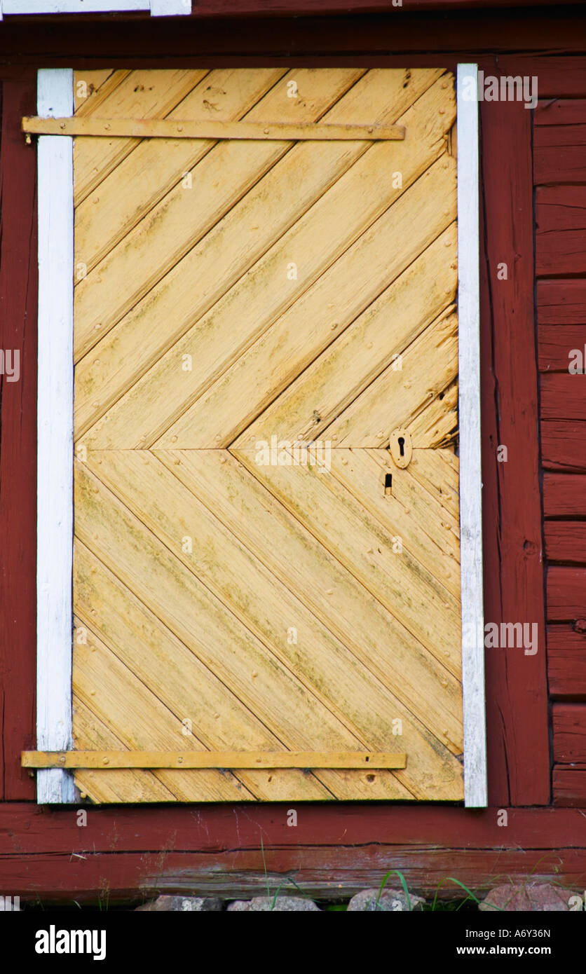Traditional style Swedish wooden painted house. A door Smaland region ...