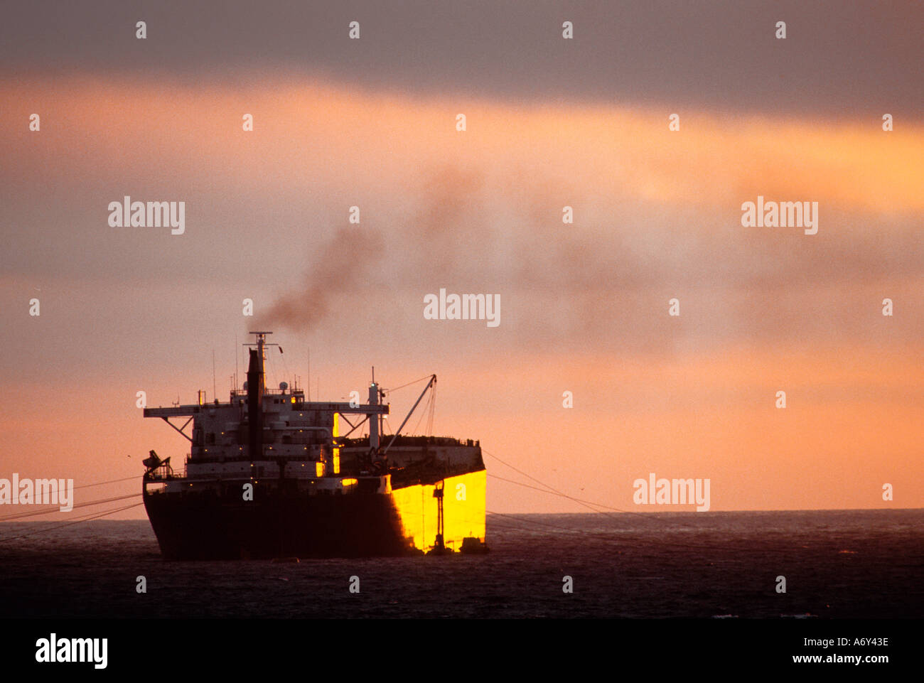 oil tanker ship at sunset Stock Photo - Alamy