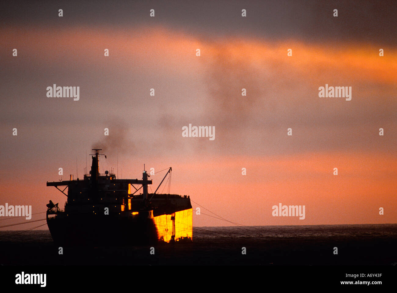 oil tanker ship at sunset Stock Photo - Alamy