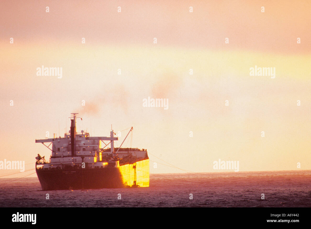 oil tanker ship at sunset Stock Photo - Alamy