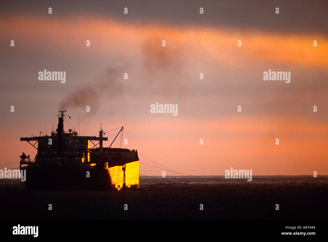 oil tanker ship at sunset Stock Photo - Alamy