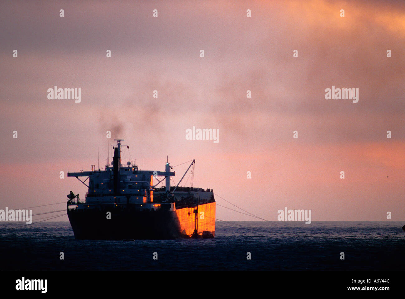 oil tanker ship at sunset Stock Photo - Alamy