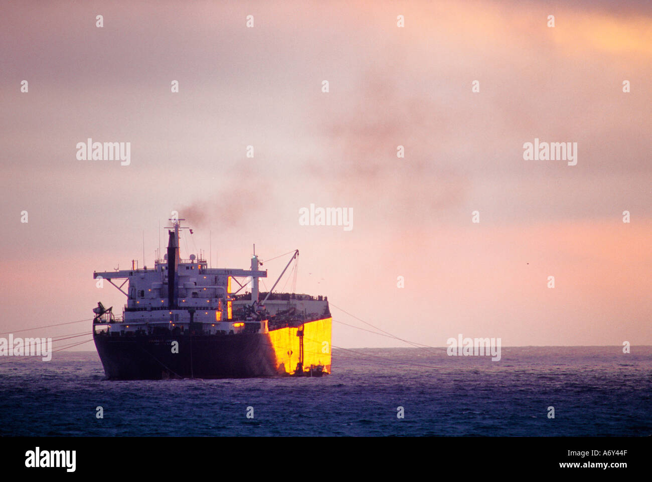 oil tanker ship at sunset Stock Photo - Alamy