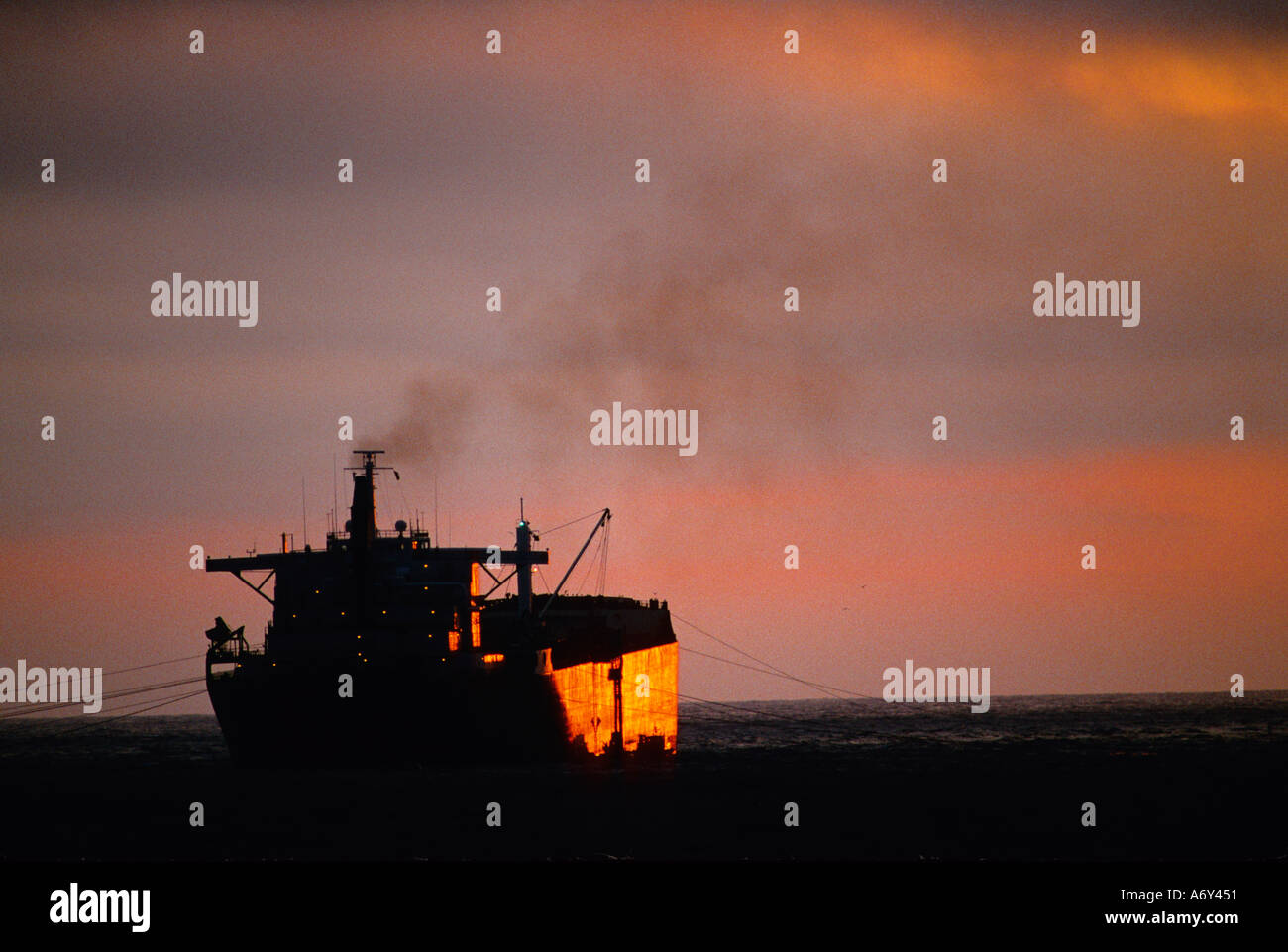 oil tanker ship at sunset Stock Photo - Alamy