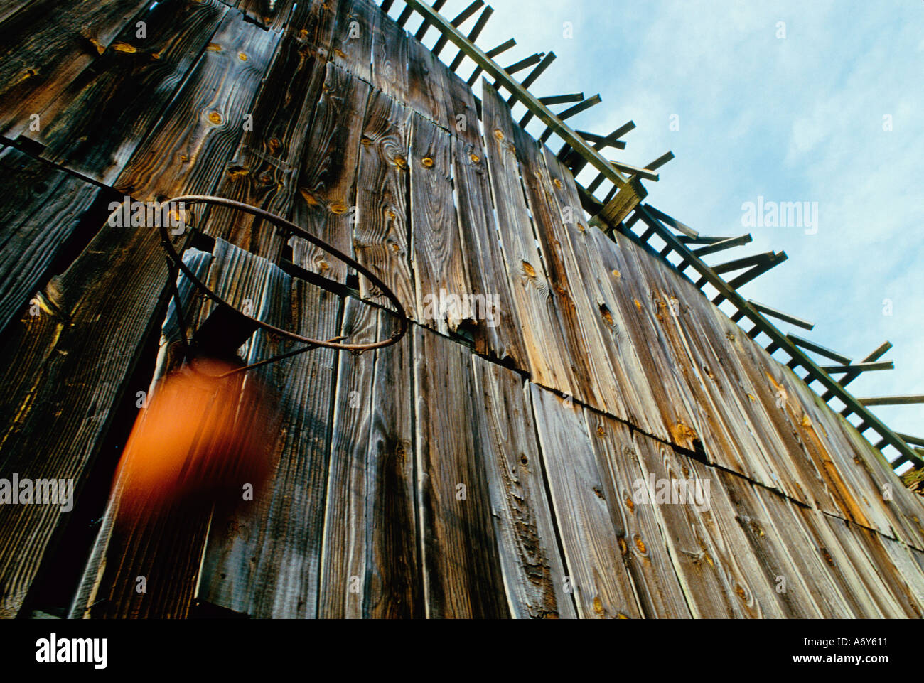 a basketball going through the hoop on an old wooden barn Stock Photo ...