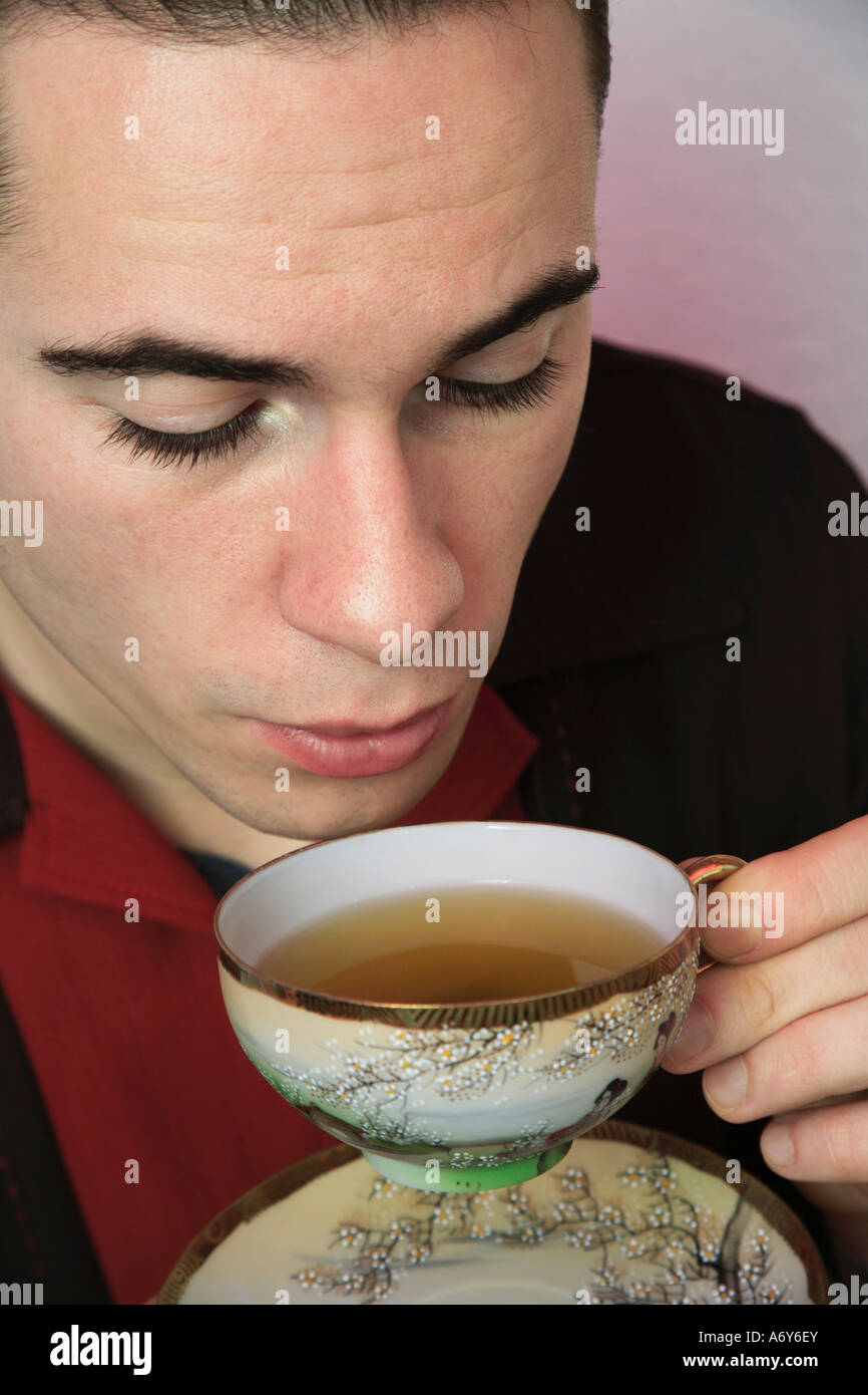 Young rockabilly man drinking tea Stock Photo - Alamy