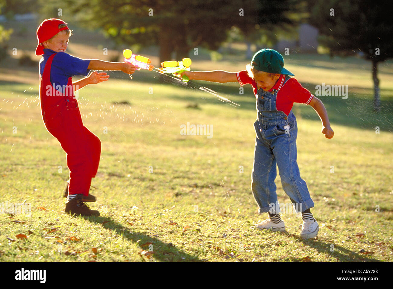 Children playing water pistols hi-res stock photography and images - Alamy