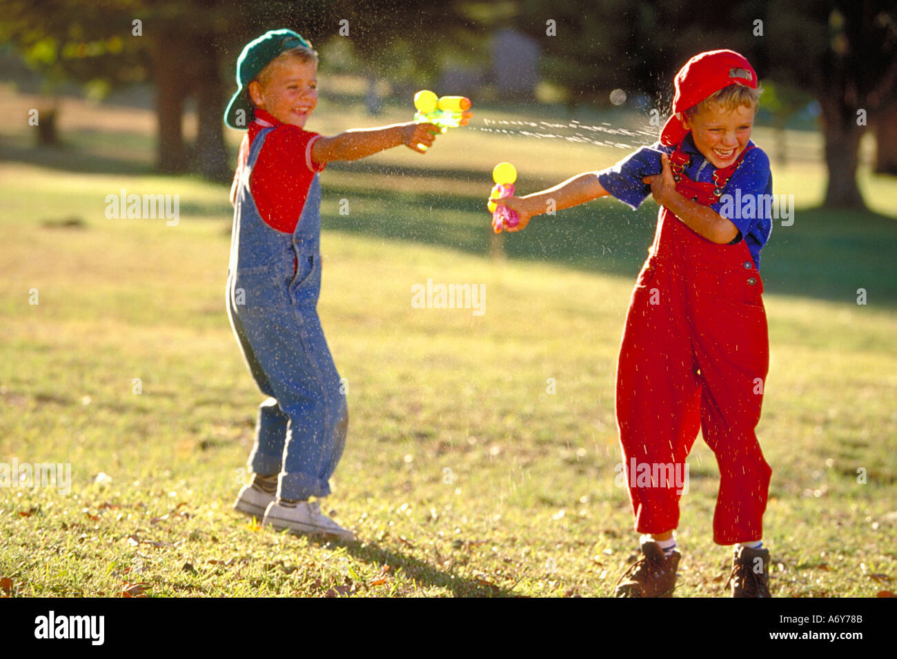 Children and water guns hi-res stock photography and images - Alamy
