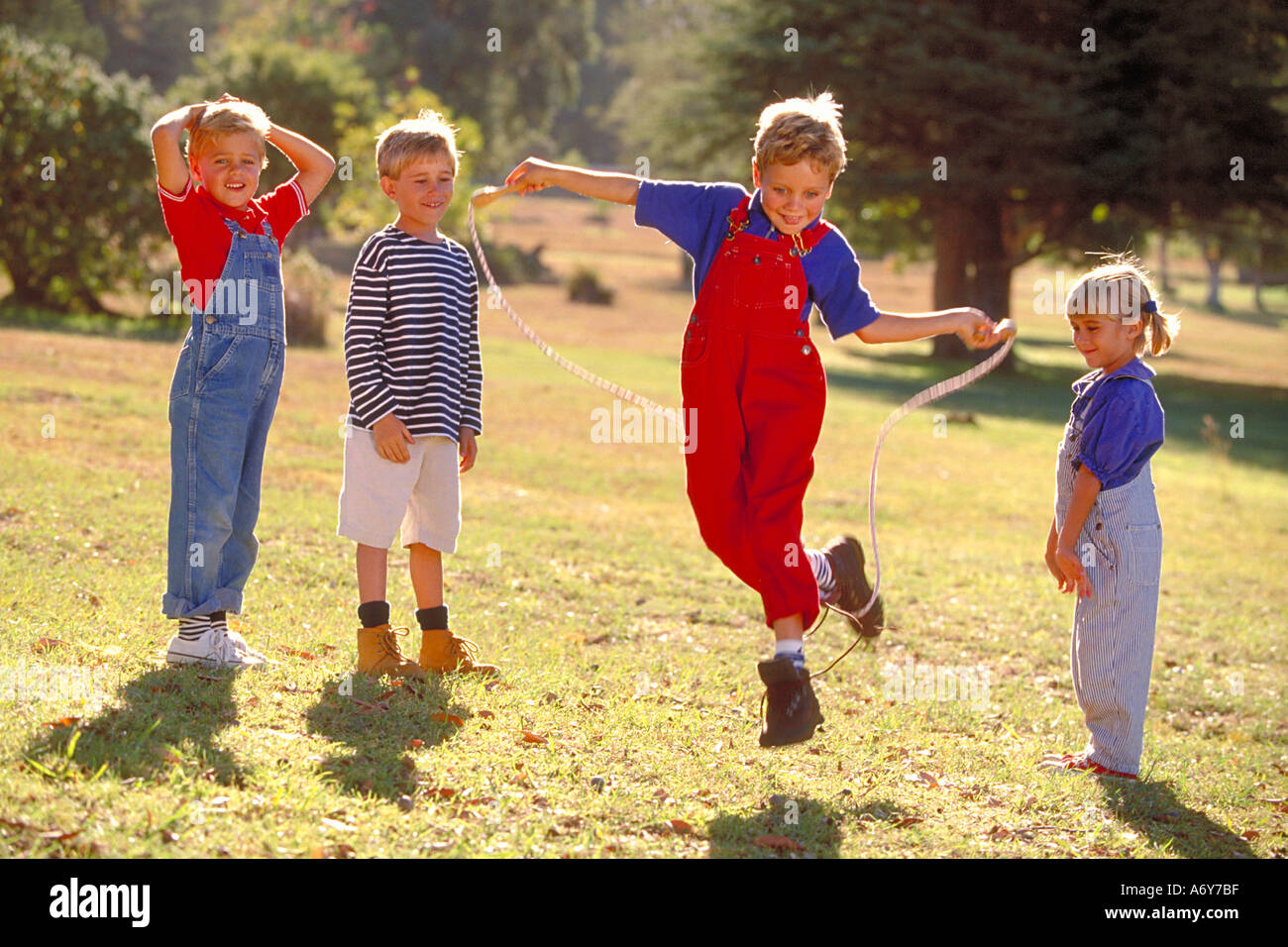 Children playing skipping rope in hi-res stock photography and images ...